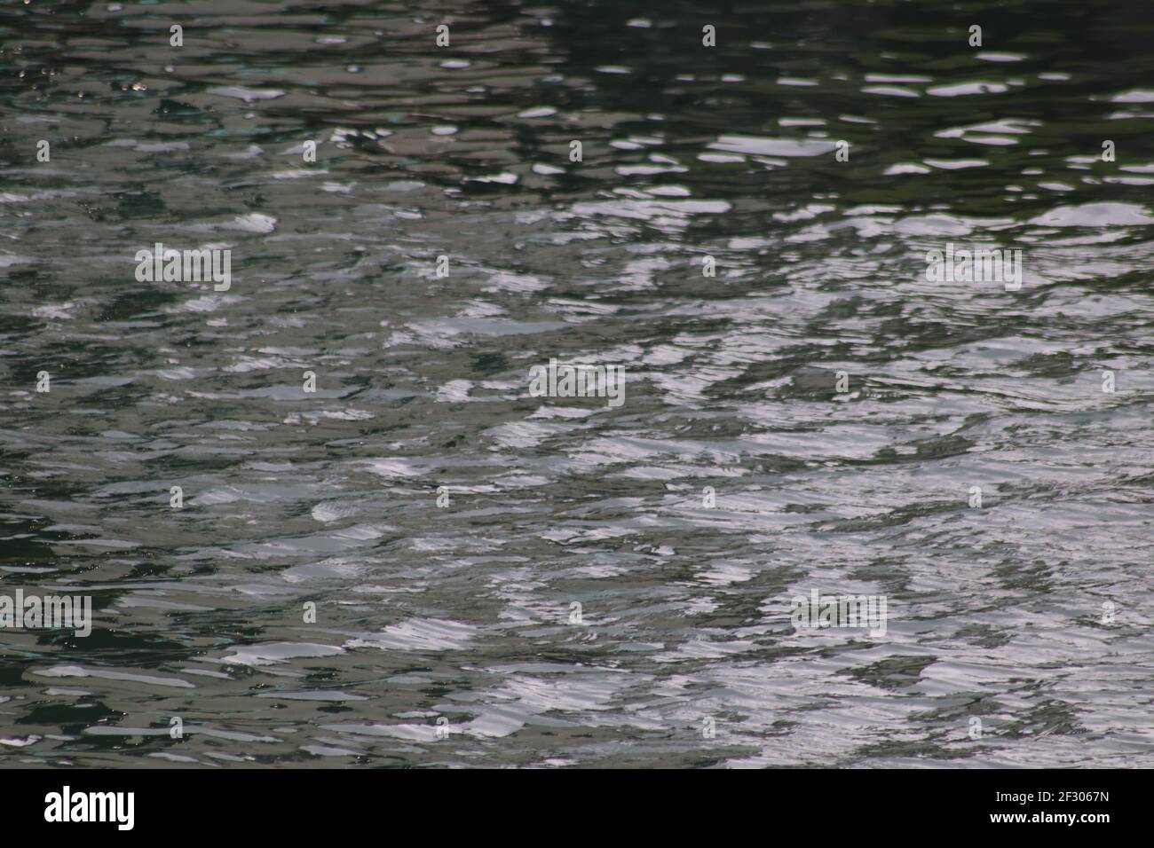 Sea water in harbour in close up Stock Photo - Alamy