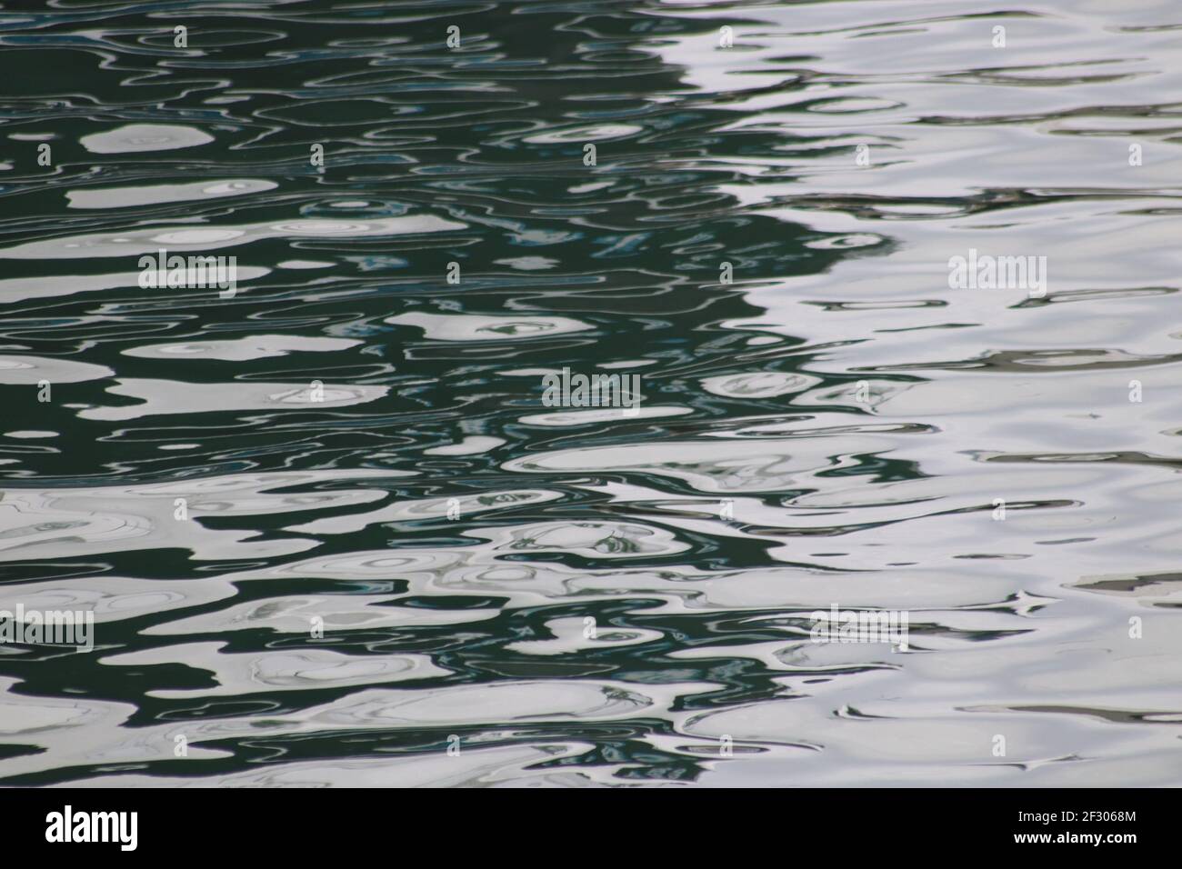 Sea water in harbour in close up Stock Photo - Alamy