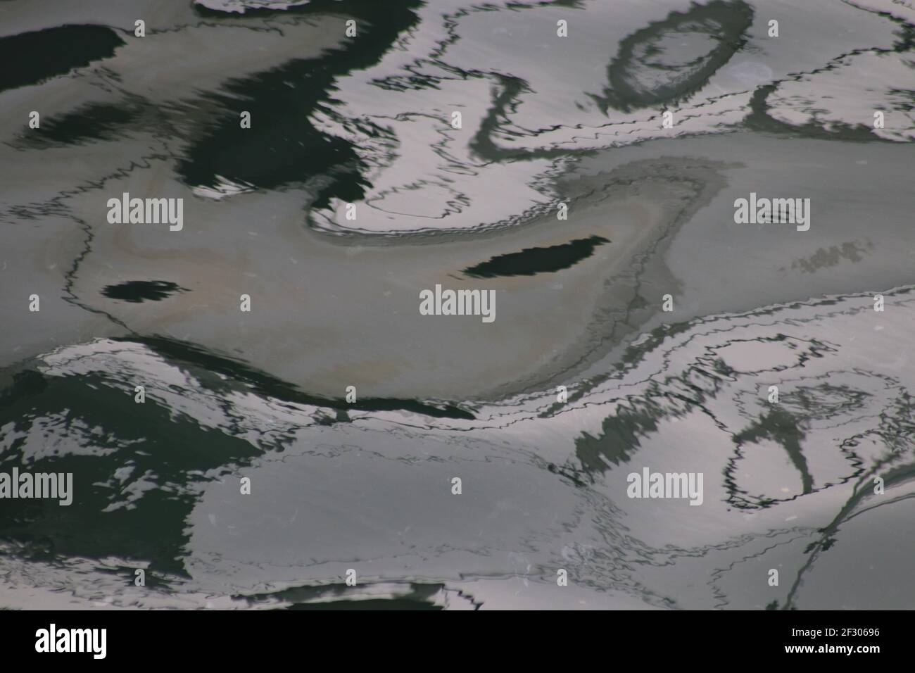 Sea water in harbour in close up Stock Photo - Alamy