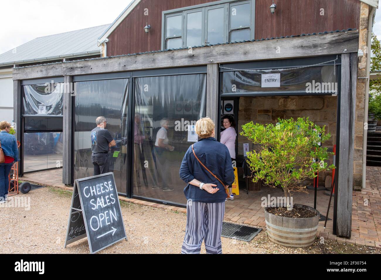 Cheese tasting in Mudgee, woman maintains social distance during covid ...