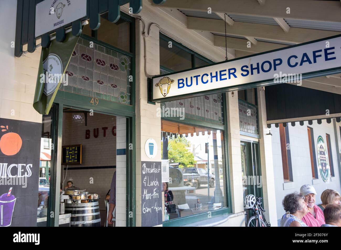 Mudgee town centre, butchers shop cafe with people enjoying coffee and ...