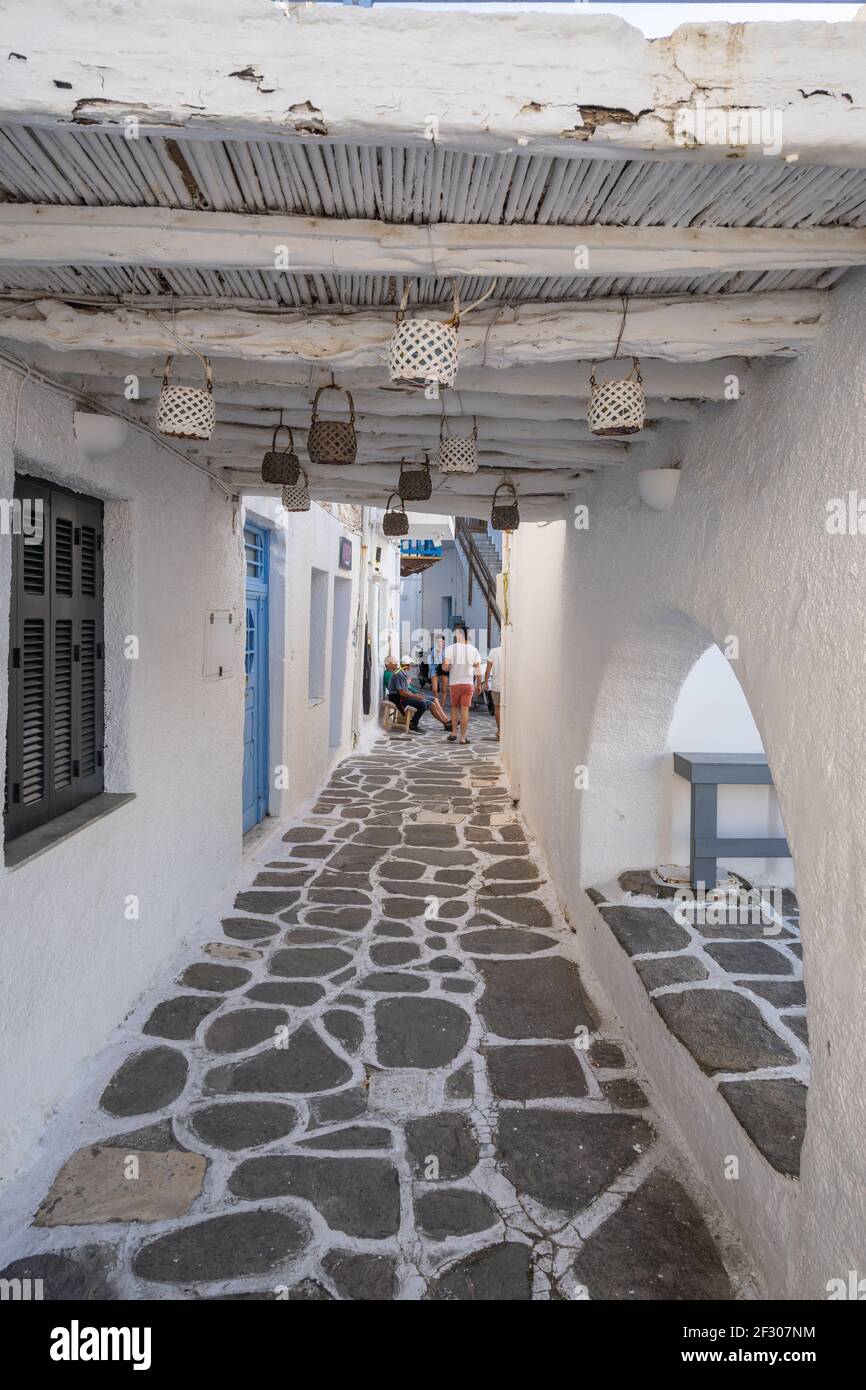 Greek street with whitewashed pavement in beautiful Naoussa on Paros ...