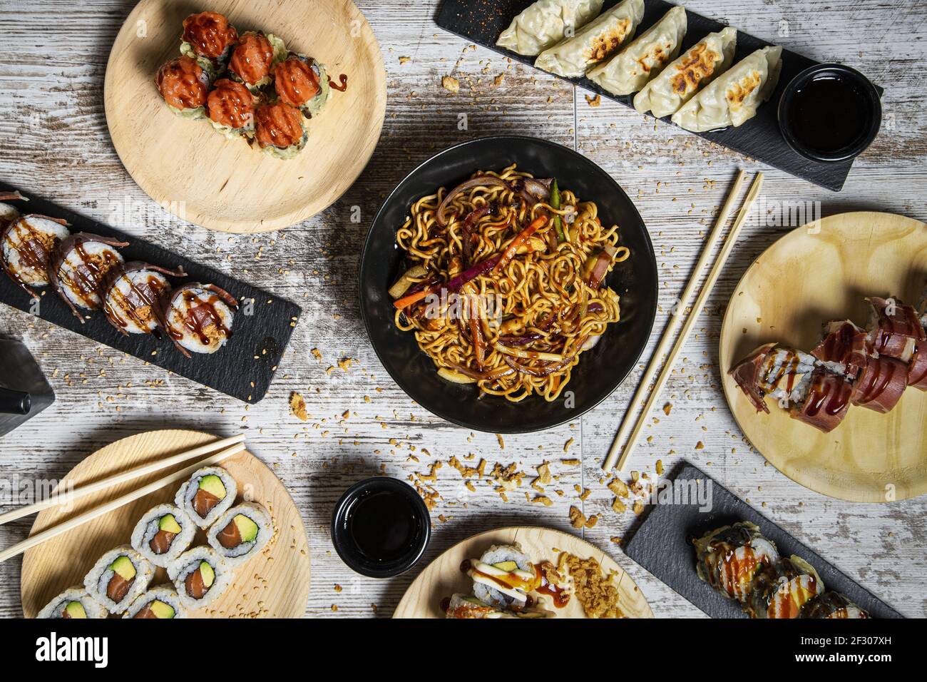 A top view of traditional Japanese dishes served on a wooden table ...