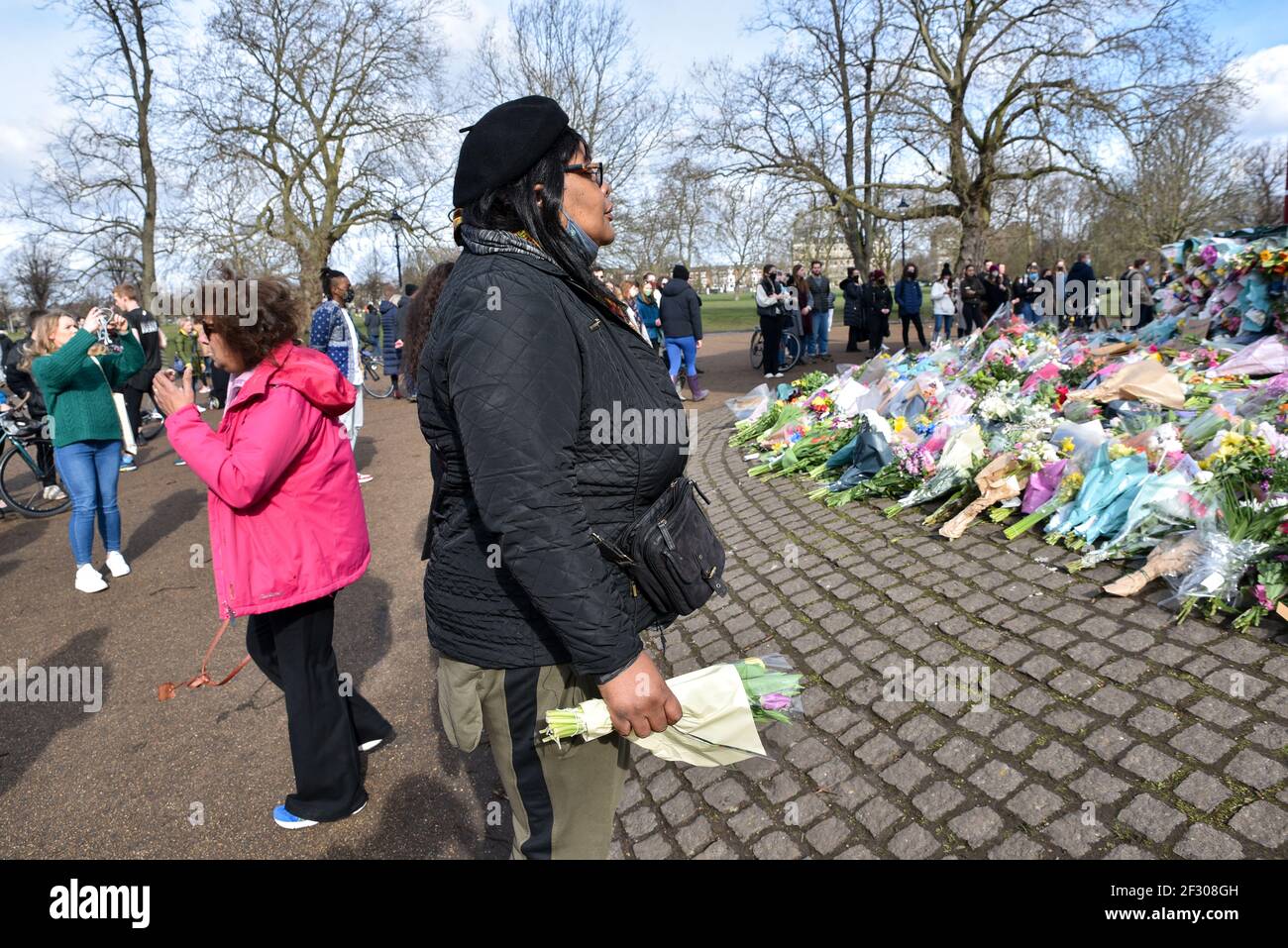 Clapham Common, London, UK. 14th Mar 2021. People paying their respects ...