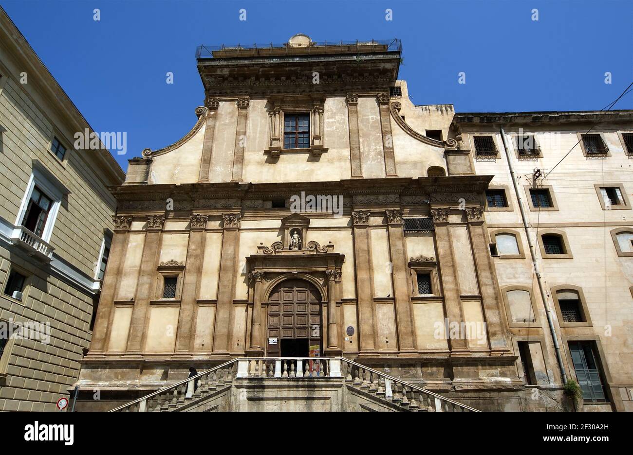 On the streets of Palermo, Sicily. The Baroque architecture is typical ...