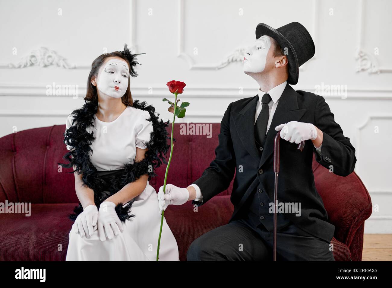 Two mime artists, love couple, scene with rose Stock Photo - Alamy