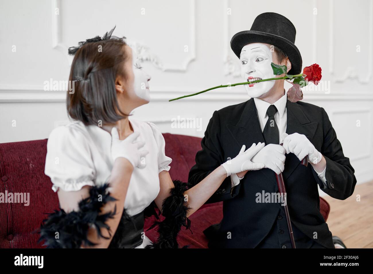 Two mime artists, love couple, scene with rose Stock Photo - Alamy