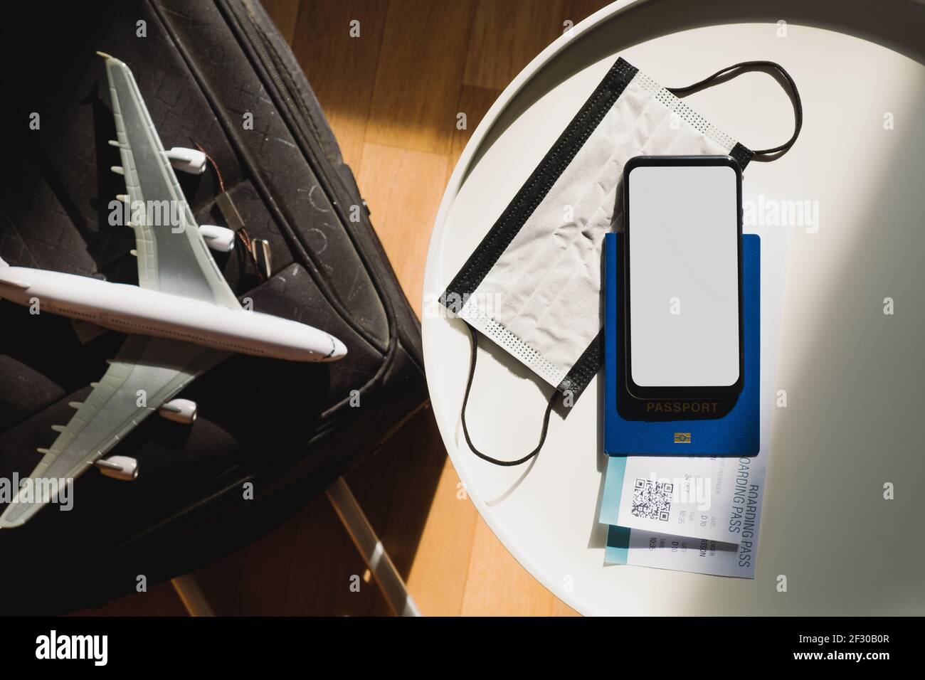 Post covid 19 travel concept. Phone with blank screen, passport ...