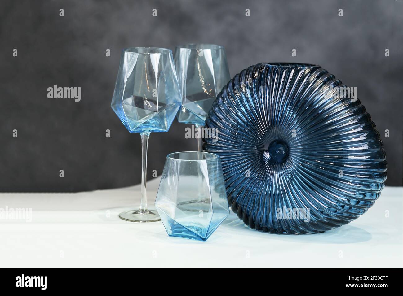 Blue vase unusual shape texture with two wine glasses Stock Photo - Alamy