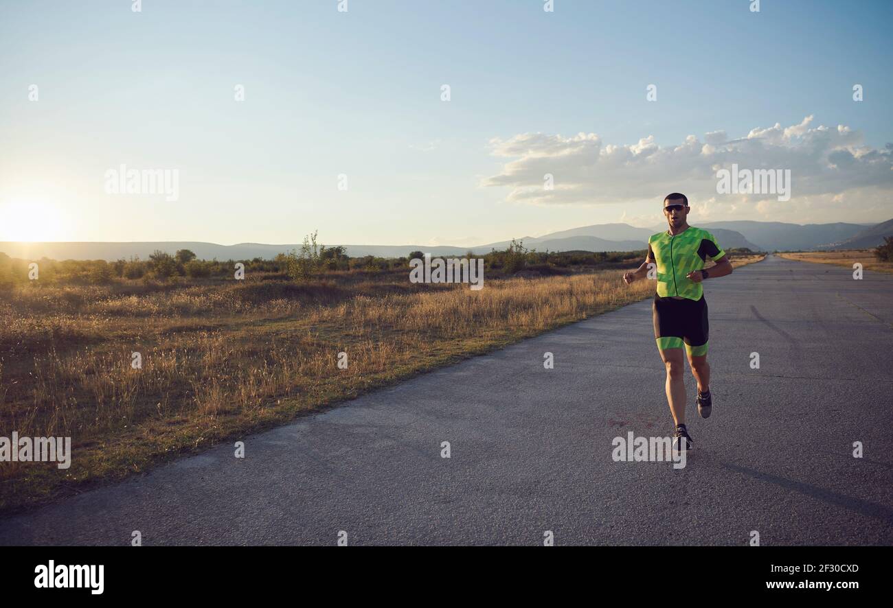 triathlon athlete running on morning trainig Stock Photo - Alamy