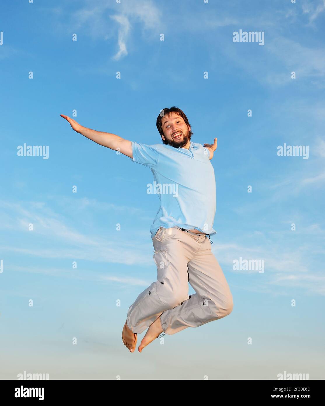 Young active man jumping Stock Photo - Alamy
