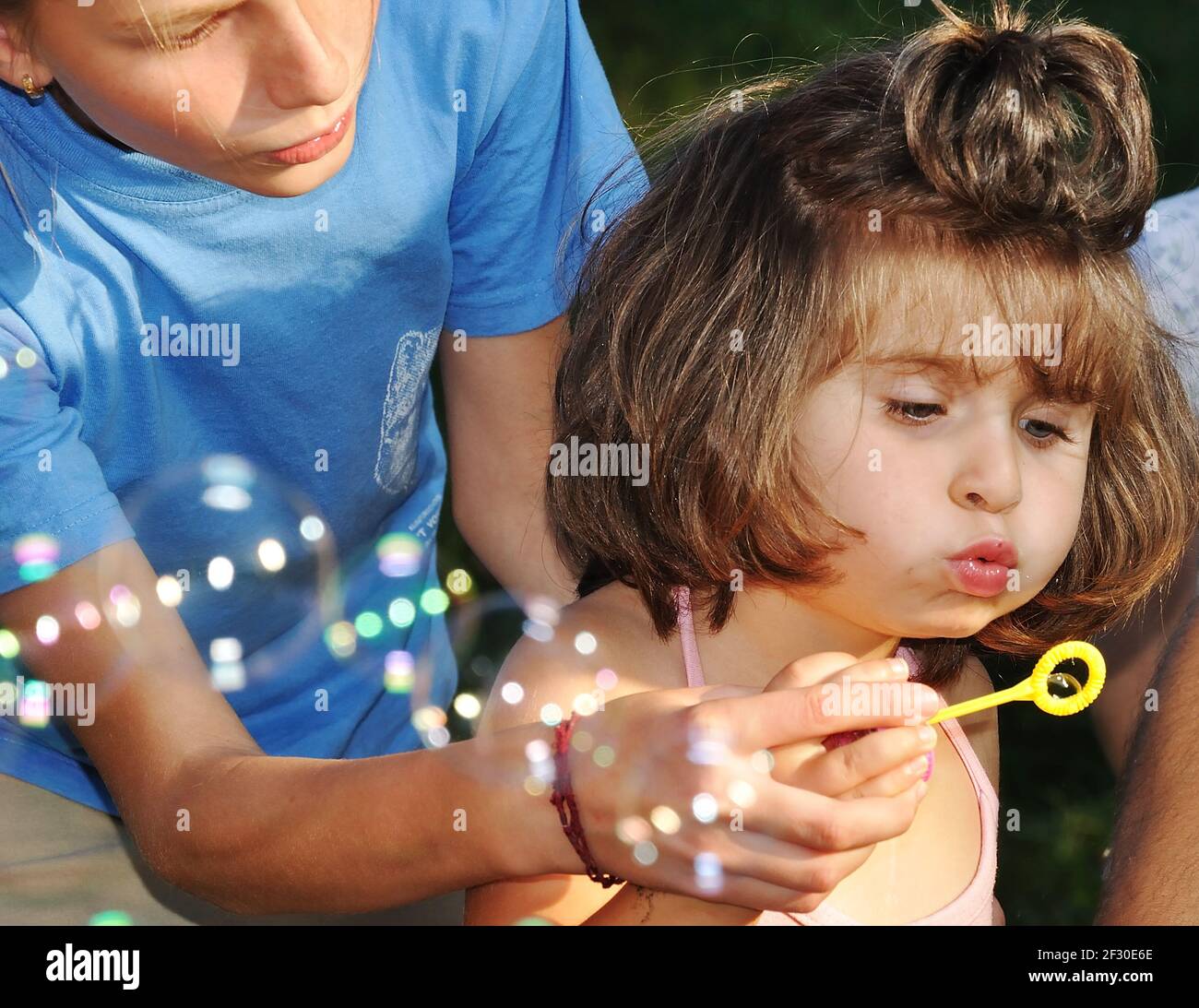 Happy beautiful children playing on ground outdoor Stock Photo - Alamy