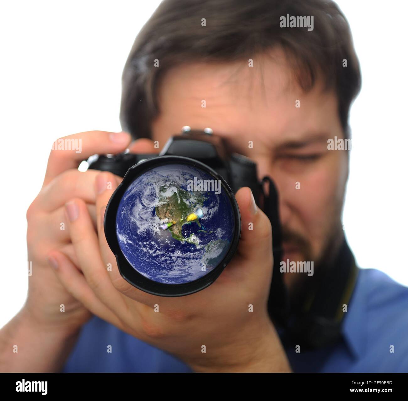 Earth in camera lens Stock Photo - Alamy