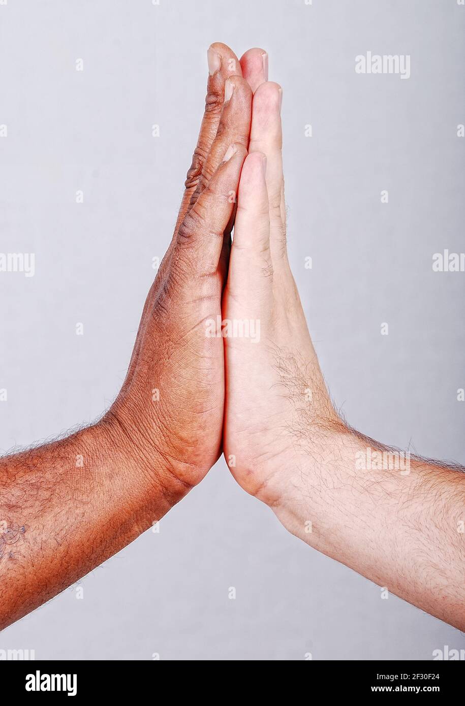 Two hands touching Stock Photo - Alamy