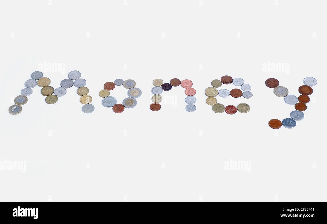 Many coins created a money word isolated Stock Photo - Alamy