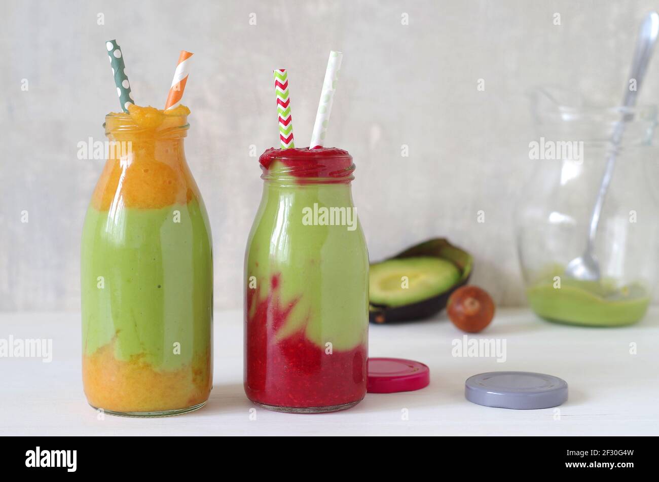 Avocado-raspberry smoothie and avocado-mango smoothie Stock Photo - Alamy
