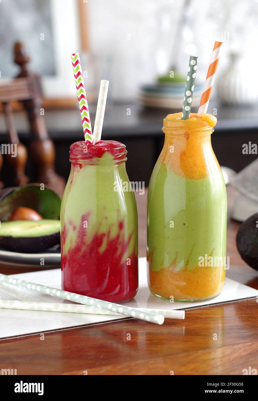 Avocado-raspberry smoothie and avocado-mango smoothie Stock Photo - Alamy