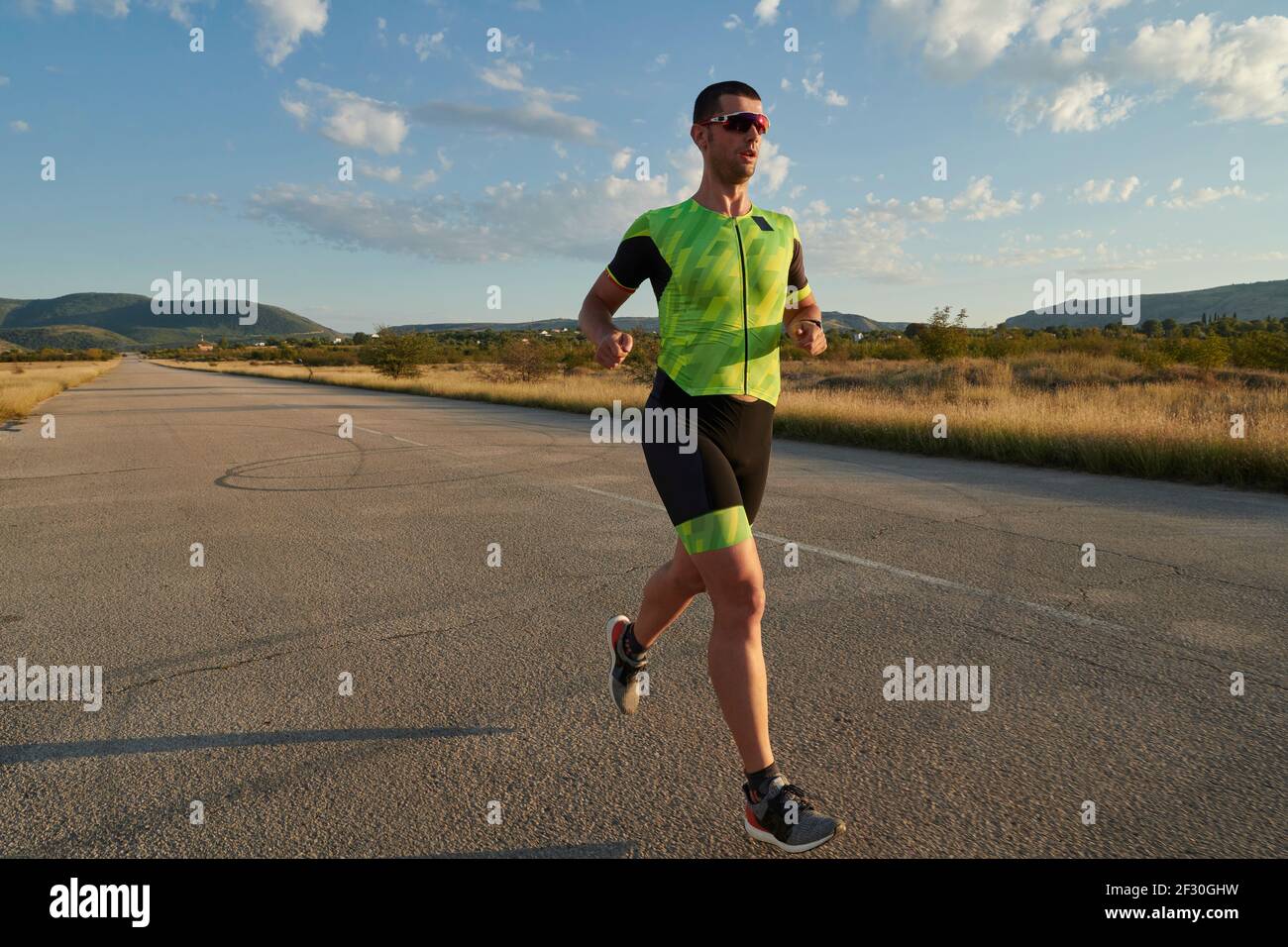 triathlon athlete running on morning trainig Stock Photo - Alamy