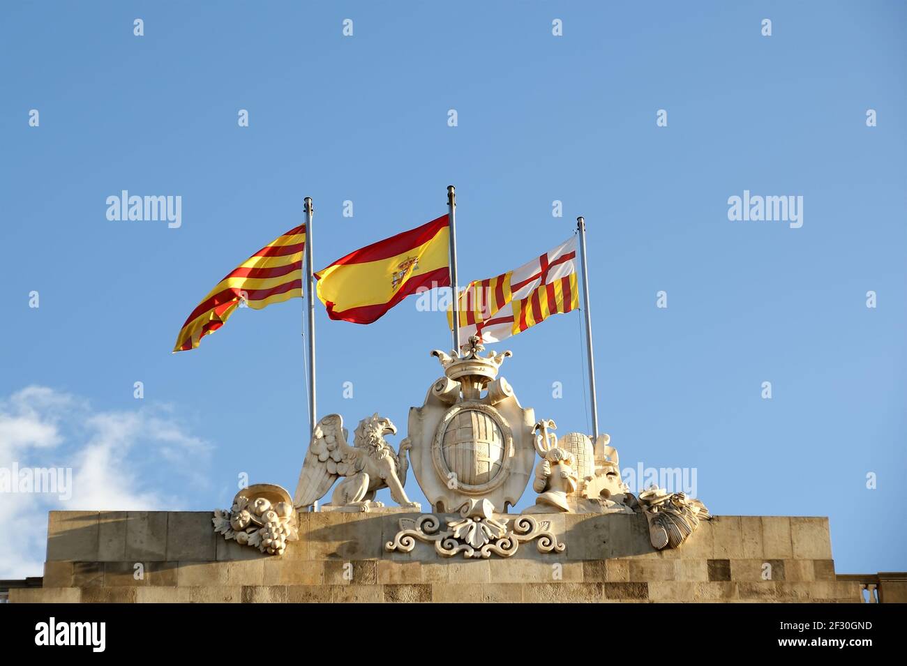 Flags of Barcelona, Catalonia and Spain on the roof of Government House ...