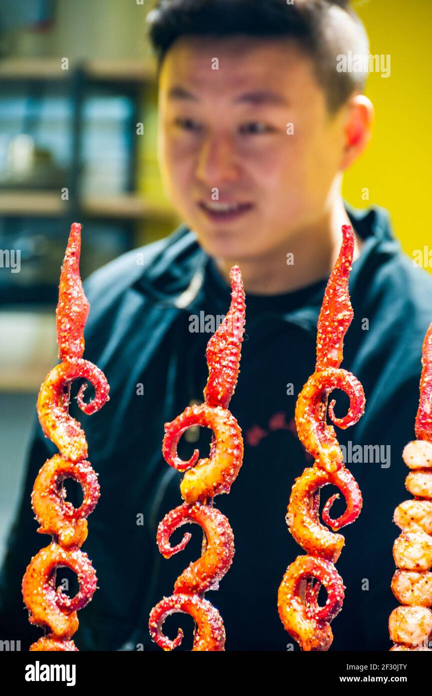 Barbecued octopus on sale at a stall in Shanghai’s Tianzifang with the ...