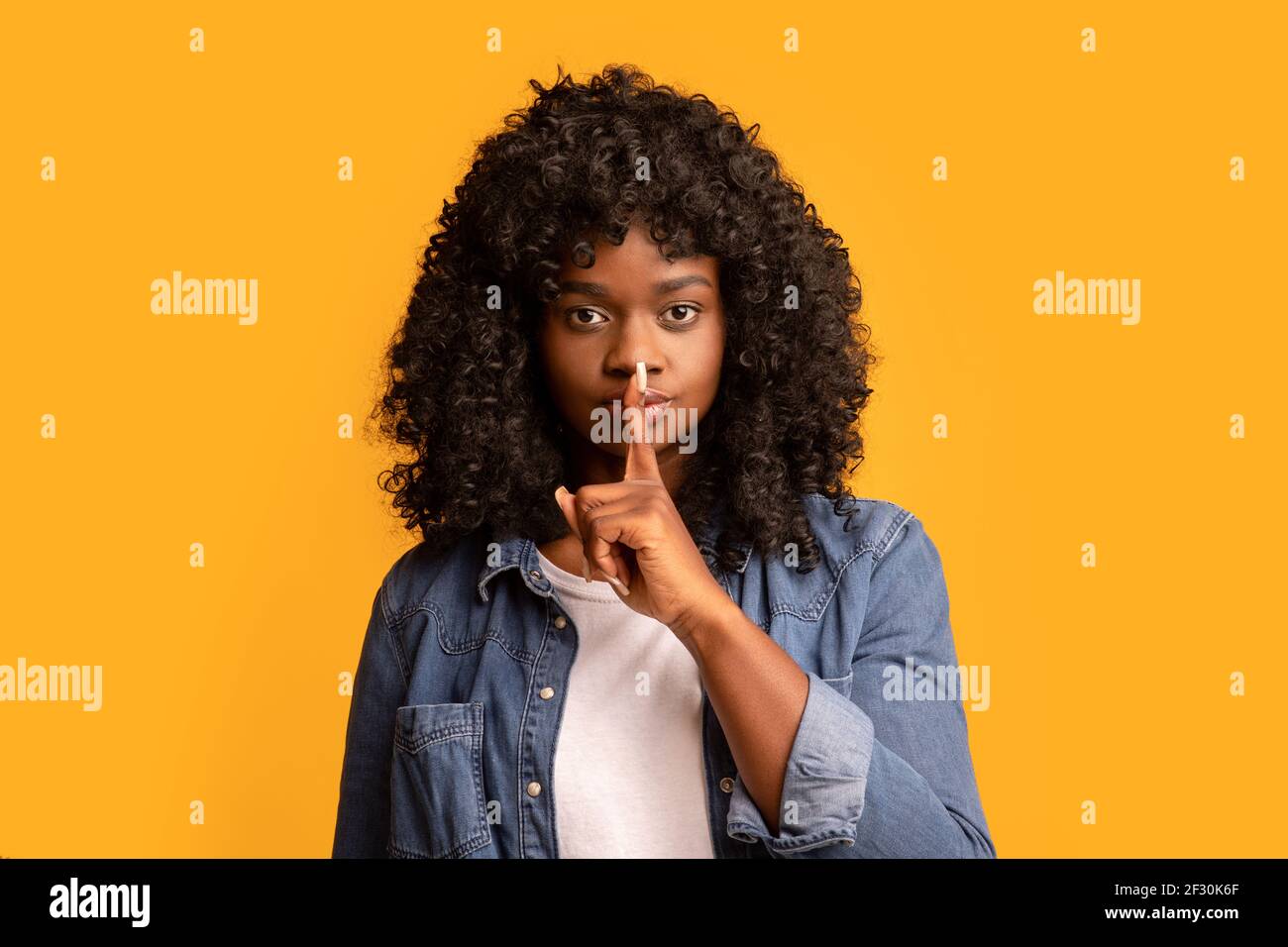 Pretty young woman doing silence hi-res stock photography and images ...