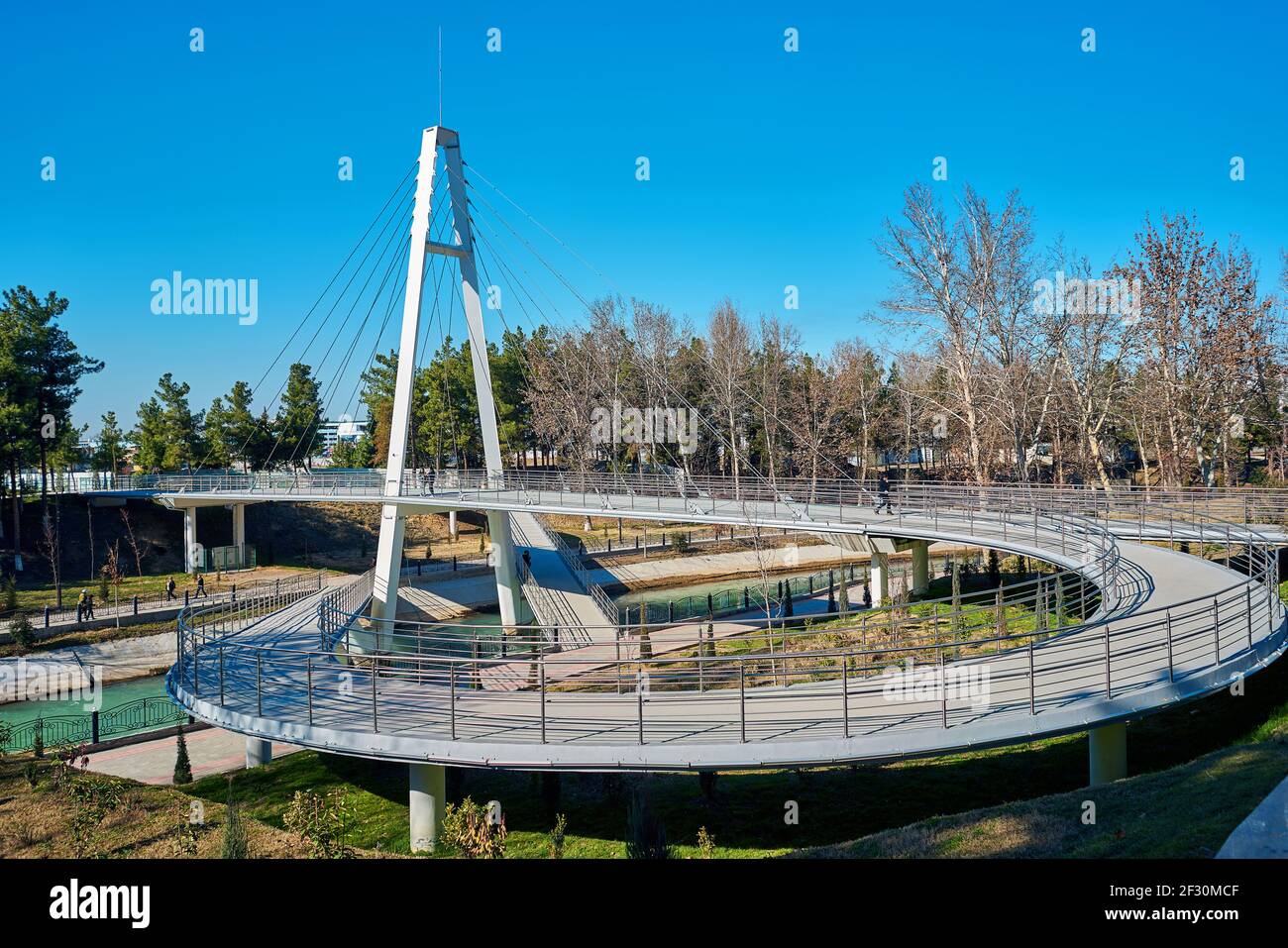 beautiful pedestrian bridge over the river Stock Photo - Alamy