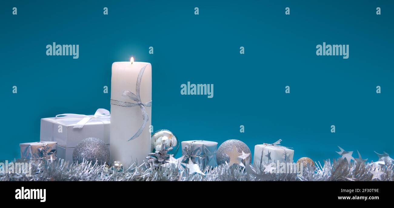 Christmas background with Advent candle and silver decoration Stock ...