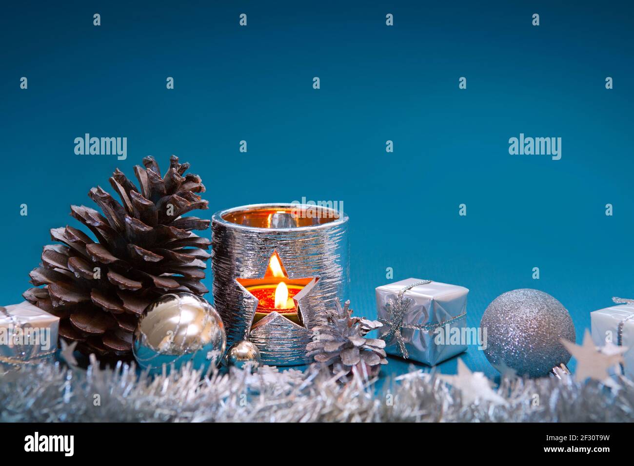 Christmas background with Advent candle and silver decoration Stock ...