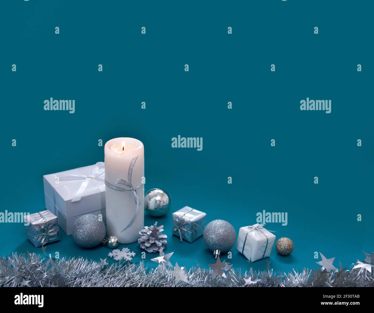 Christmas background with Advent candle and silver decoration Stock ...
