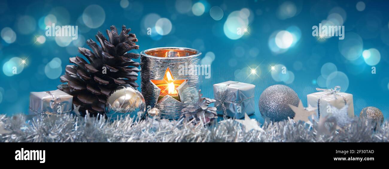 Christmas background with Advent candle and silver decoration Stock ...