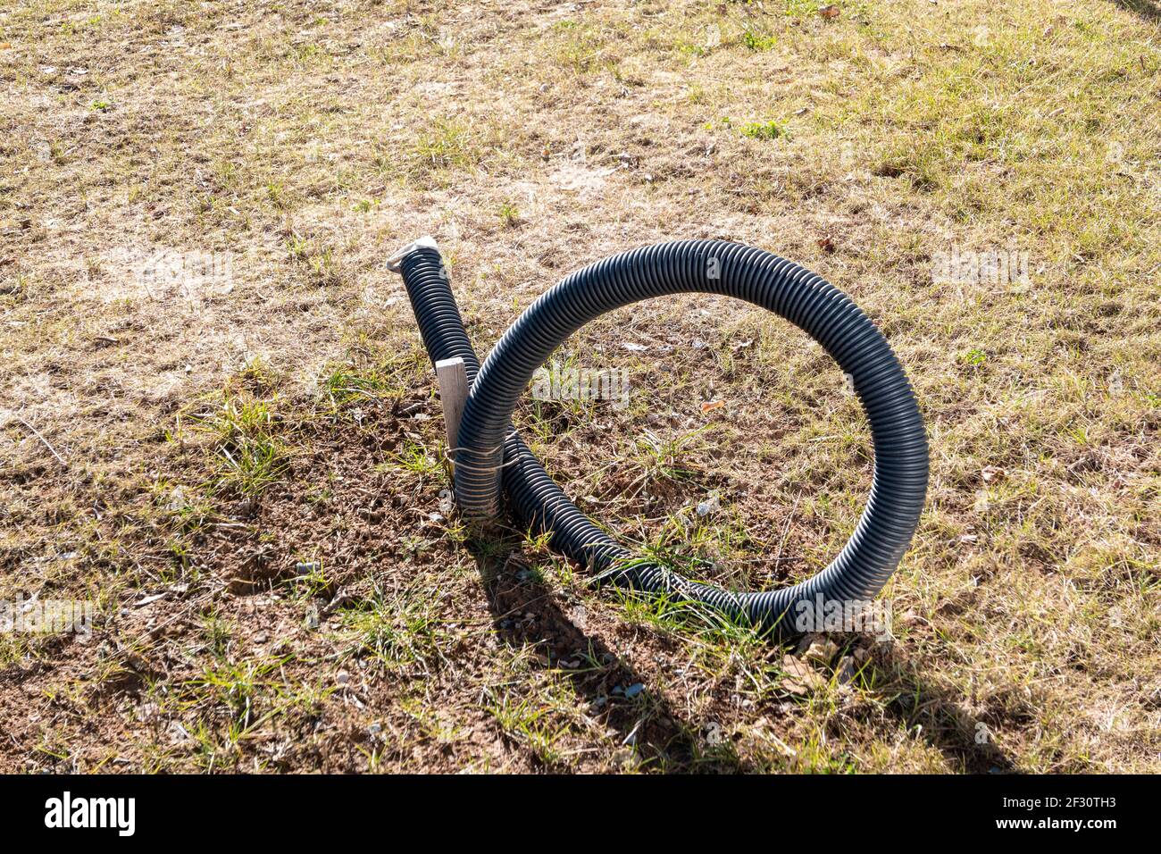 empty plastic tube for cable from the ground Stock Photo - Alamy