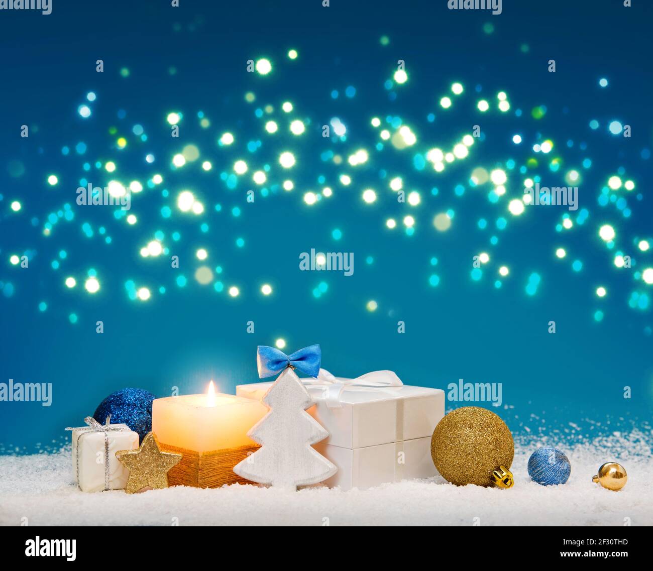 Christmas background with Advent candle and decoration on white snow ...