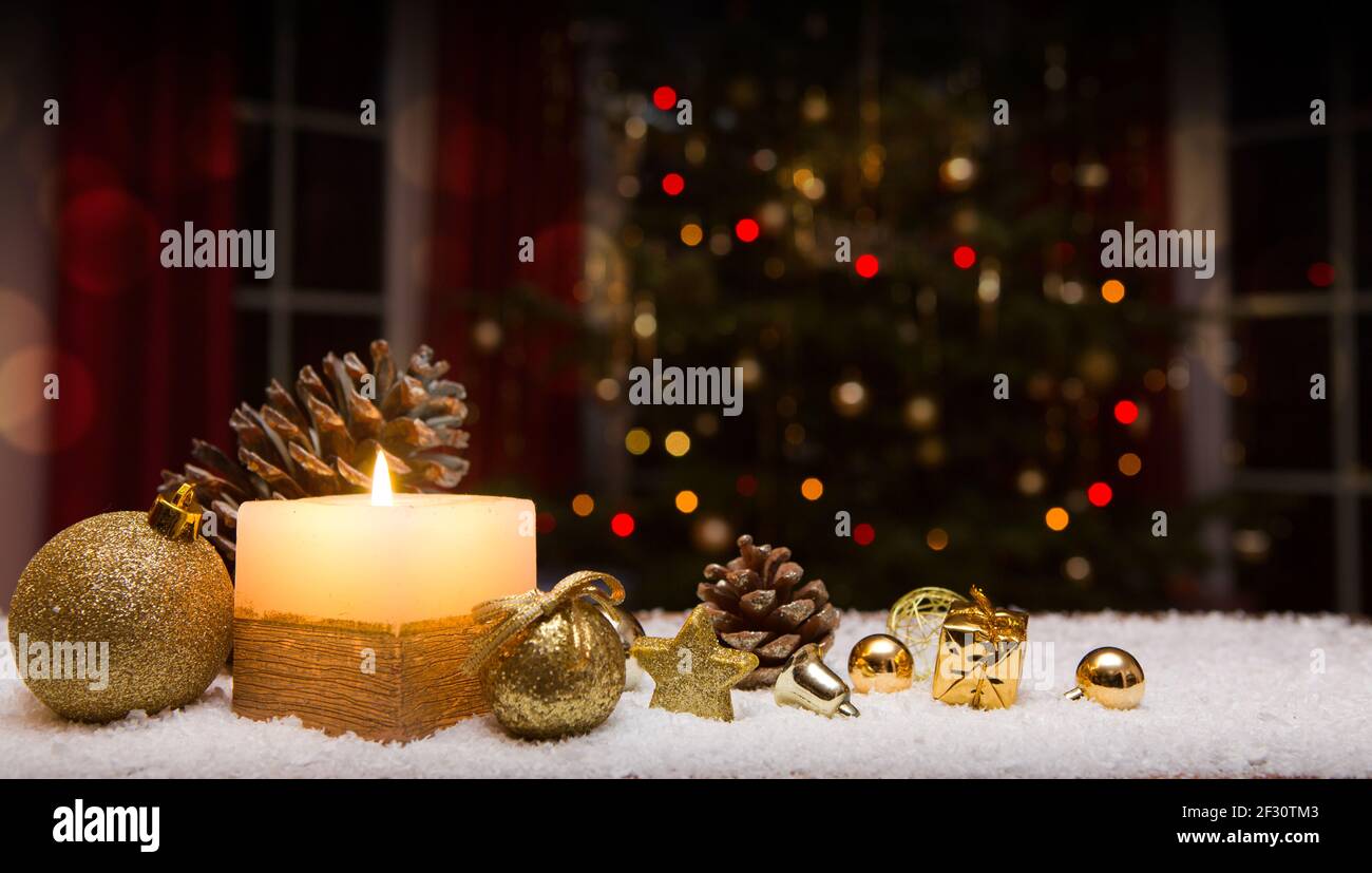 Christmas white candle with golden decorations and fir tree Stock Photo ...