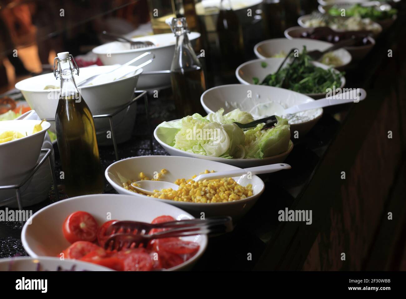 The white plates with vegetables at a buffet Stock Photo - Alamy