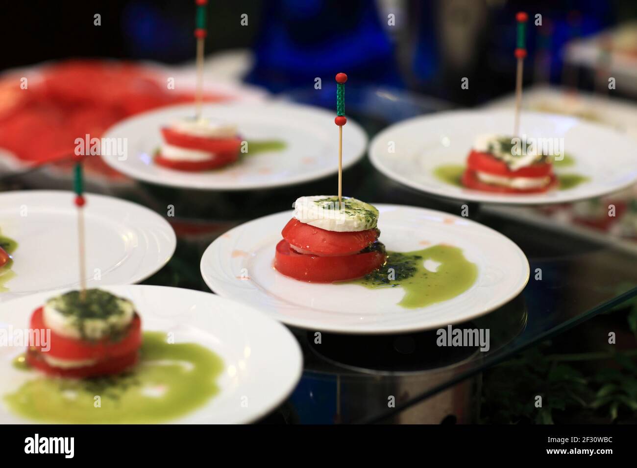 Plates with caprese canape at the buffet Stock Photo - Alamy