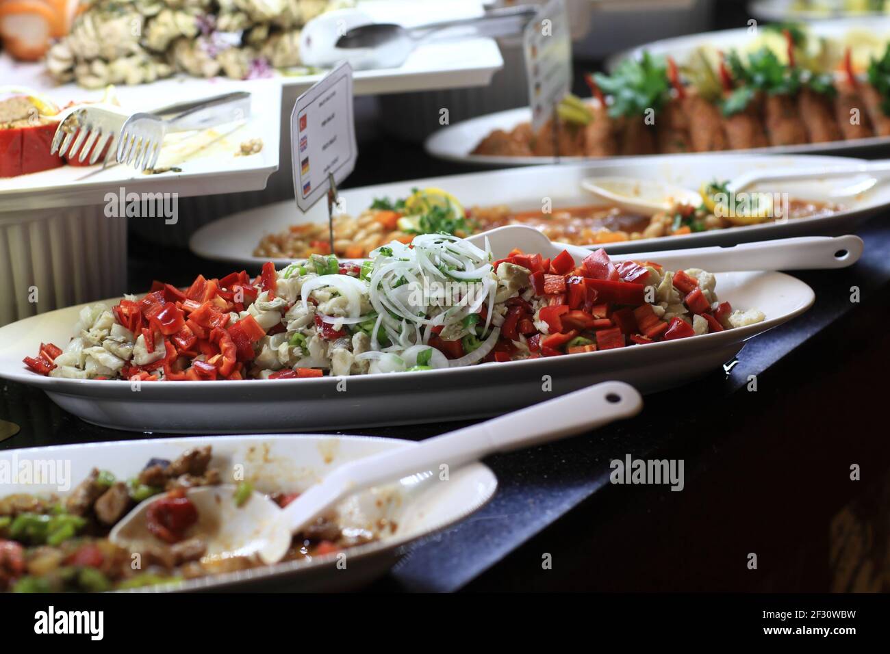 Plates with various salads at a buffet Stock Photo - Alamy