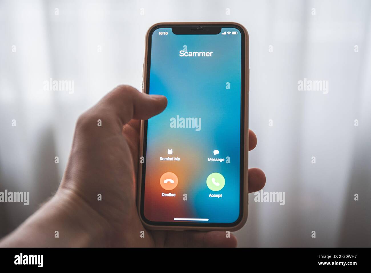 Incoming call from Scammer. Scam on phone and online Stock Photo - Alamy