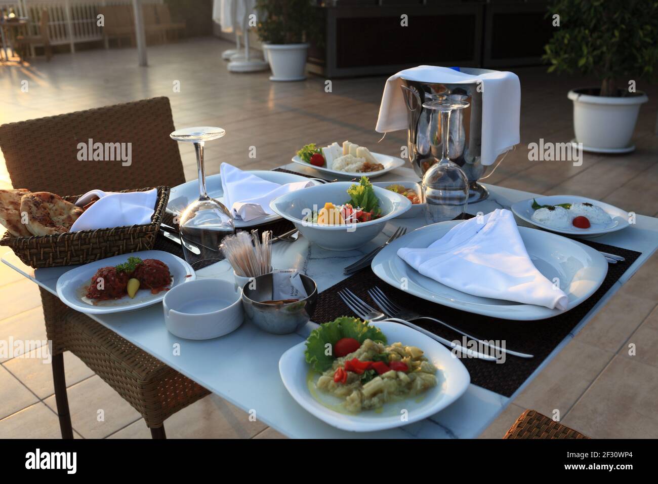 Assorted Turkish meze on a dining table in a restaurant Stock Photo - Alamy