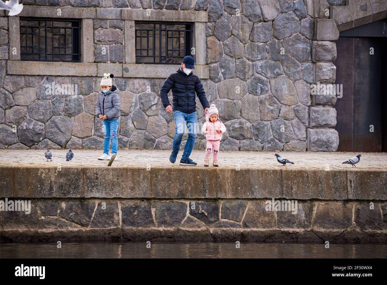 Prague, Czech republic - March 12. Children with parents playing with ...