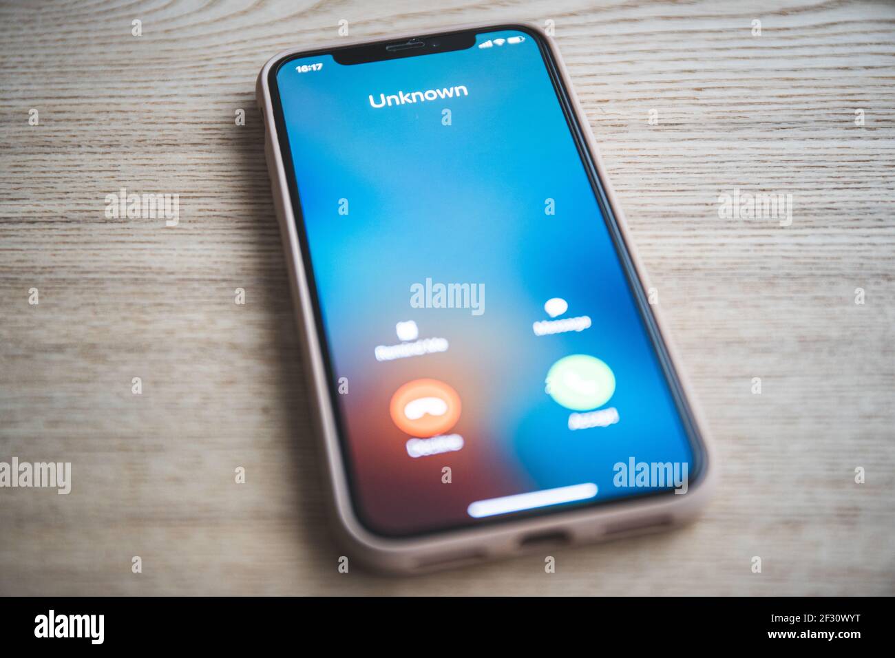 Incoming call from unknown number. Scam online on phone Stock Photo - Alamy