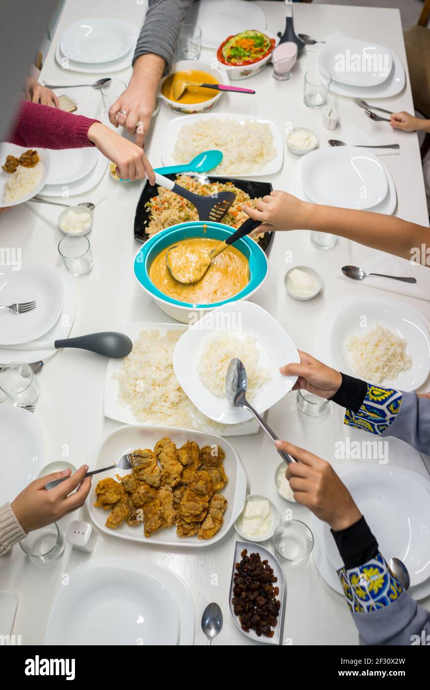 Man men male woman women female table family friends hi-res stock ...