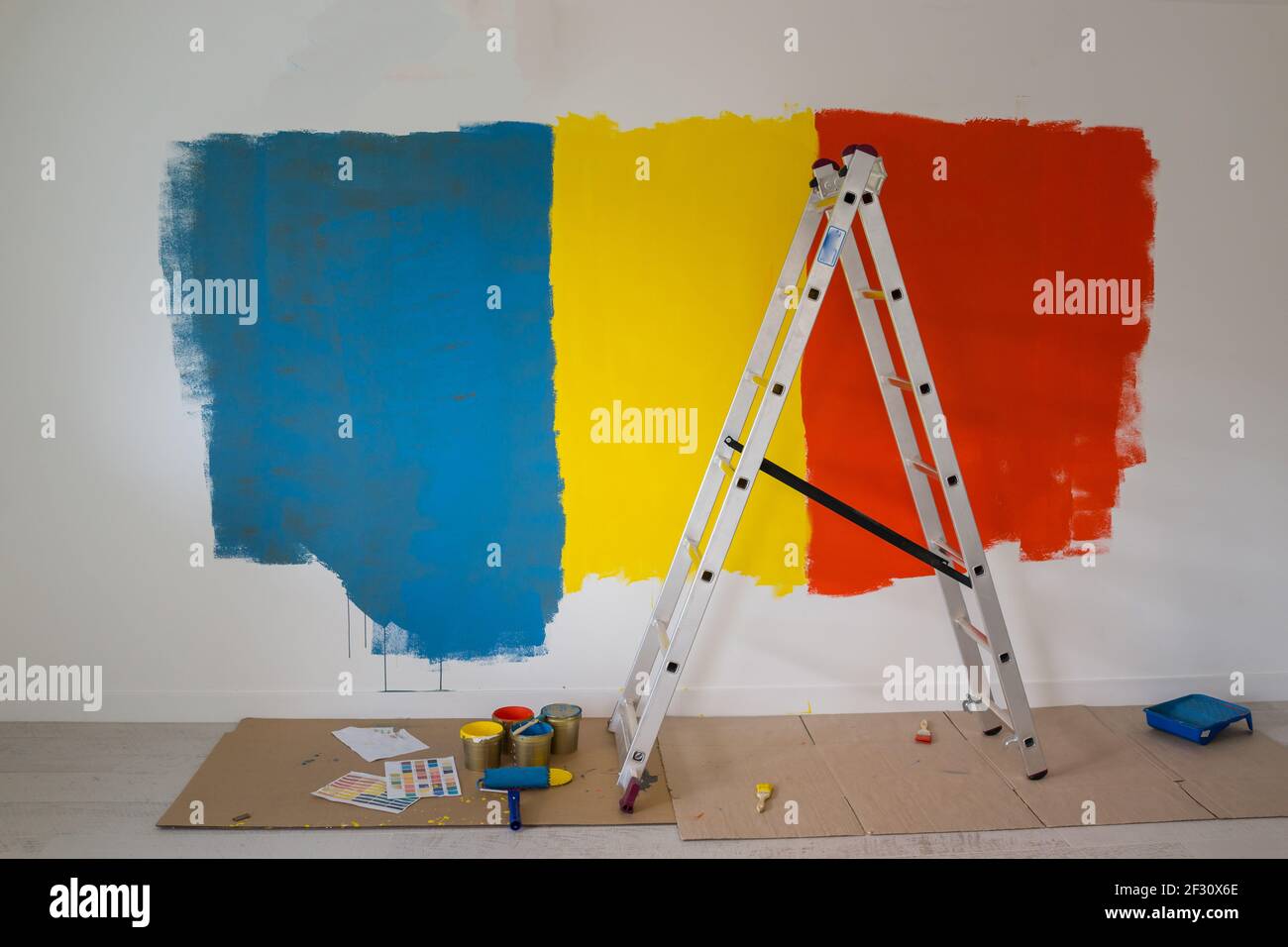 Ladders for painting wall at home Stock Photo - Alamy
