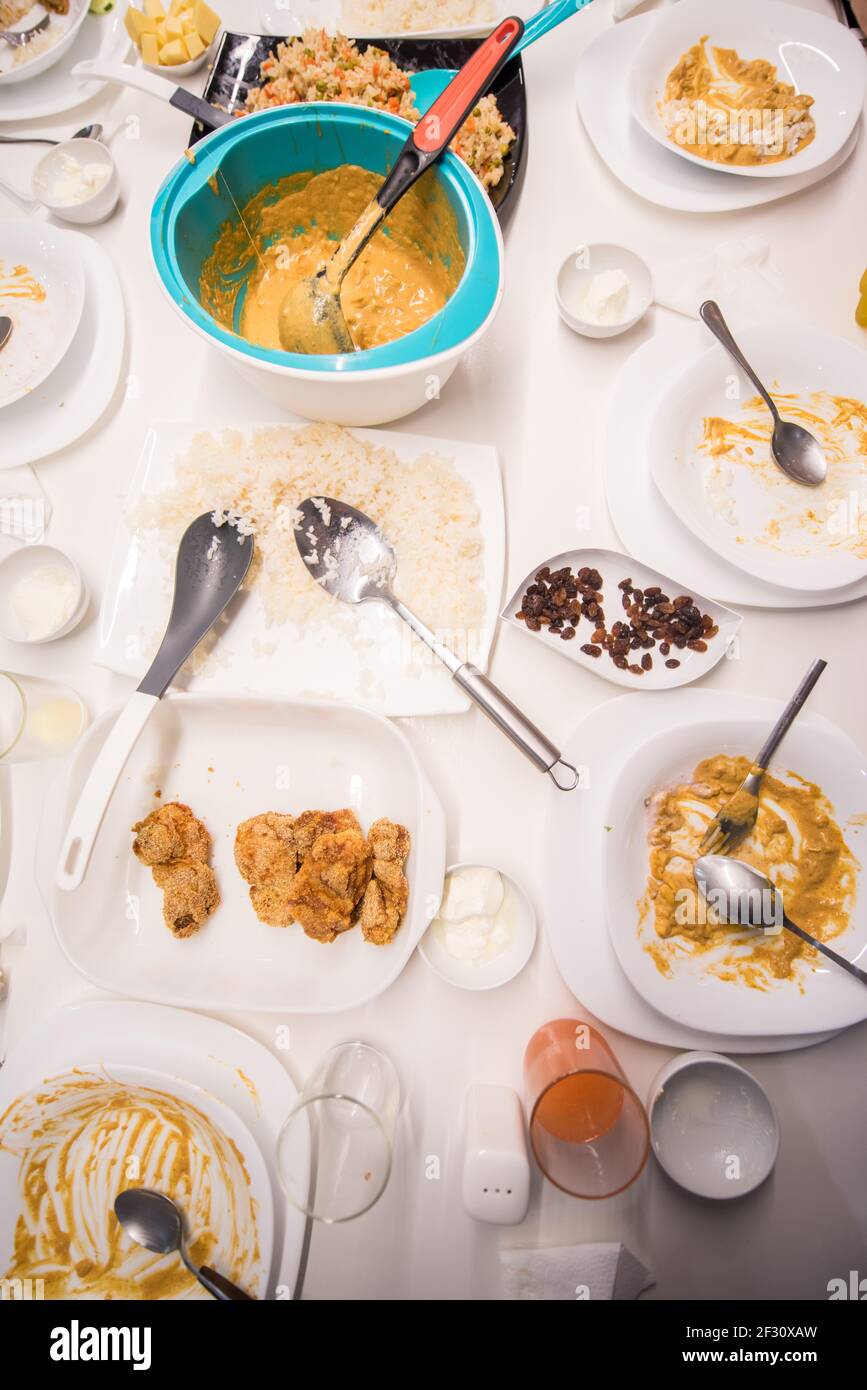 Beautiful ready lunch on dining table in modern home Stock Photo - Alamy