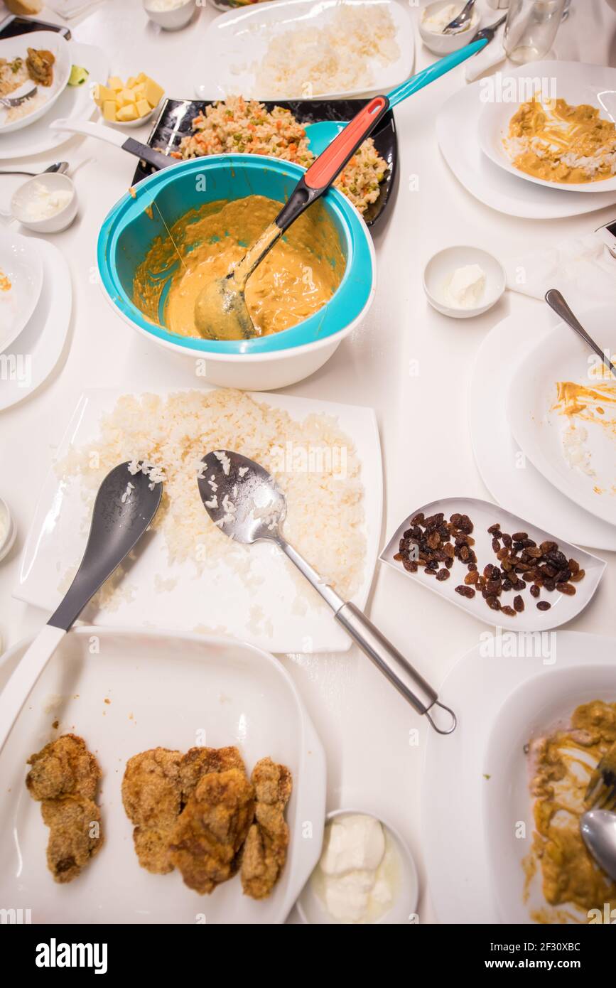 Beautiful ready lunch on dining table in modern home Stock Photo - Alamy
