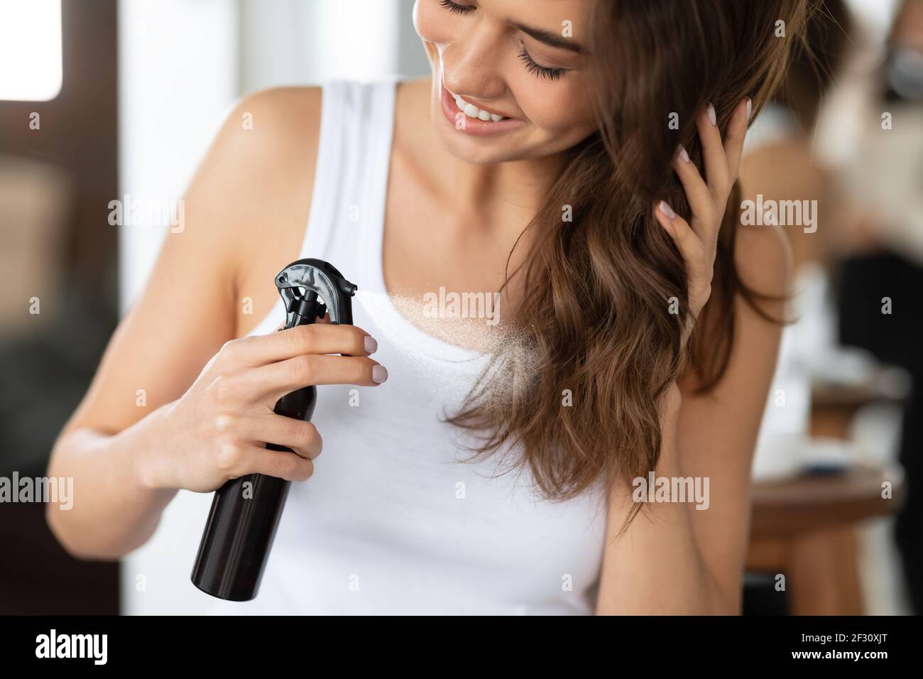 Hair spray spraying hi-res stock photography and images - Alamy