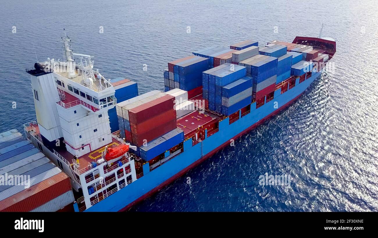 ULCV container ship sails on open water fully loaded with containers ...