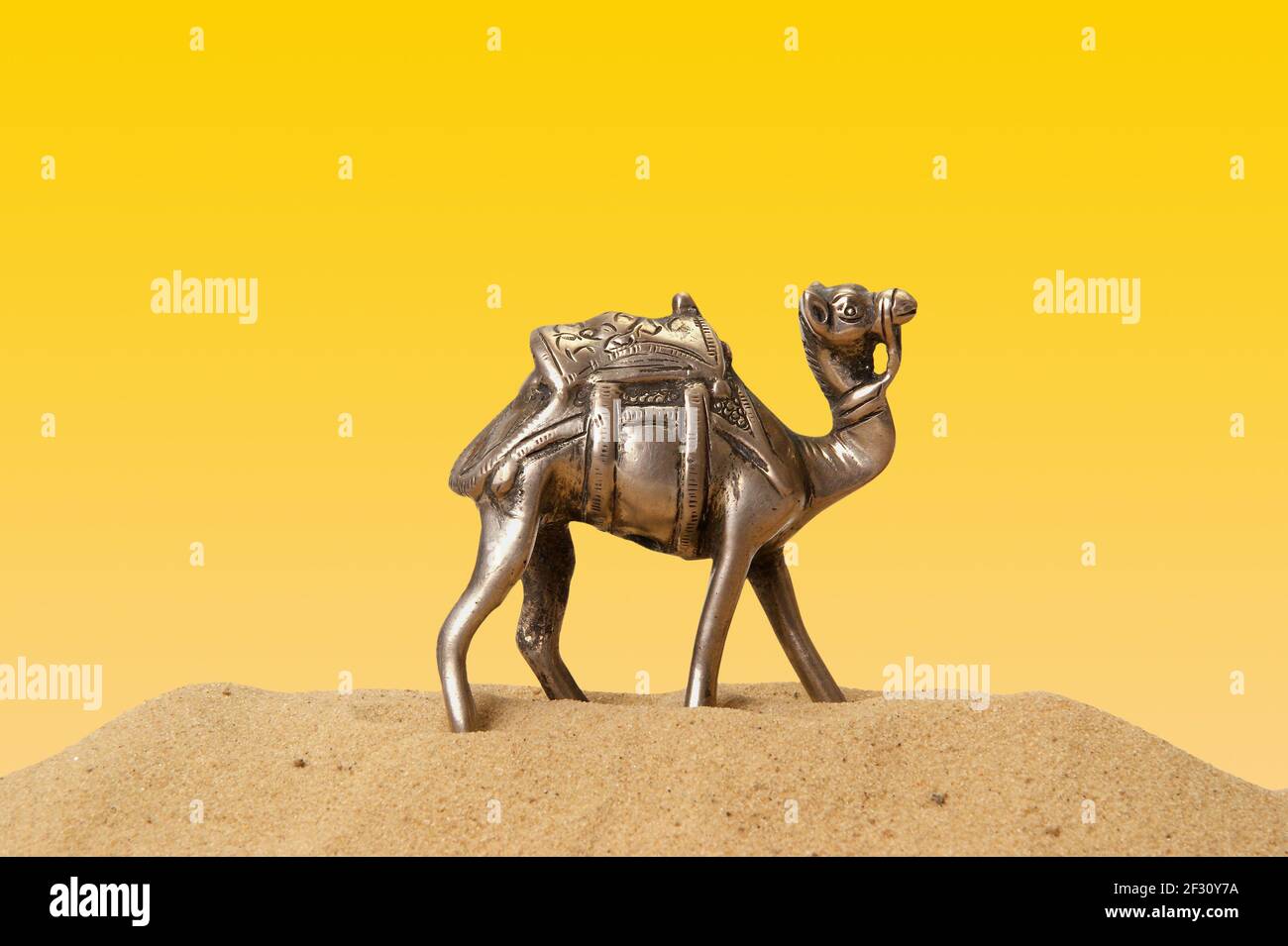 figurine of a camel made of metal, isolation Stock Photo - Alamy