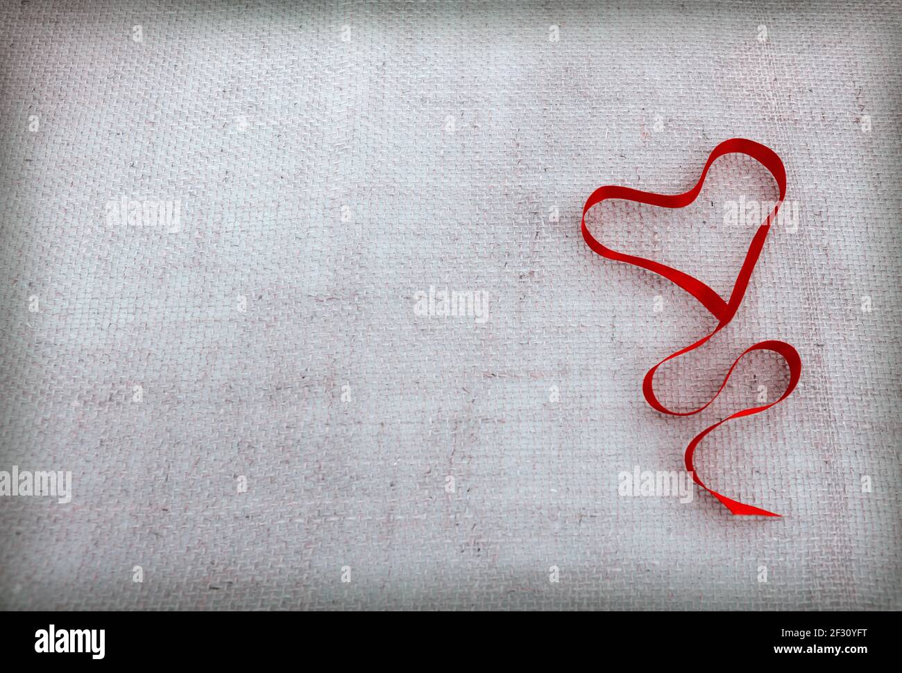 Valentine's day background with red heart ribbon isolated on gray Stock ...