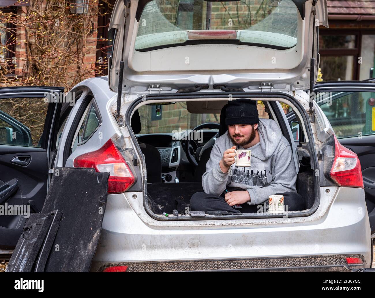 Time for a cuppa, taking a tea break in the back of a Ford Focus car ...