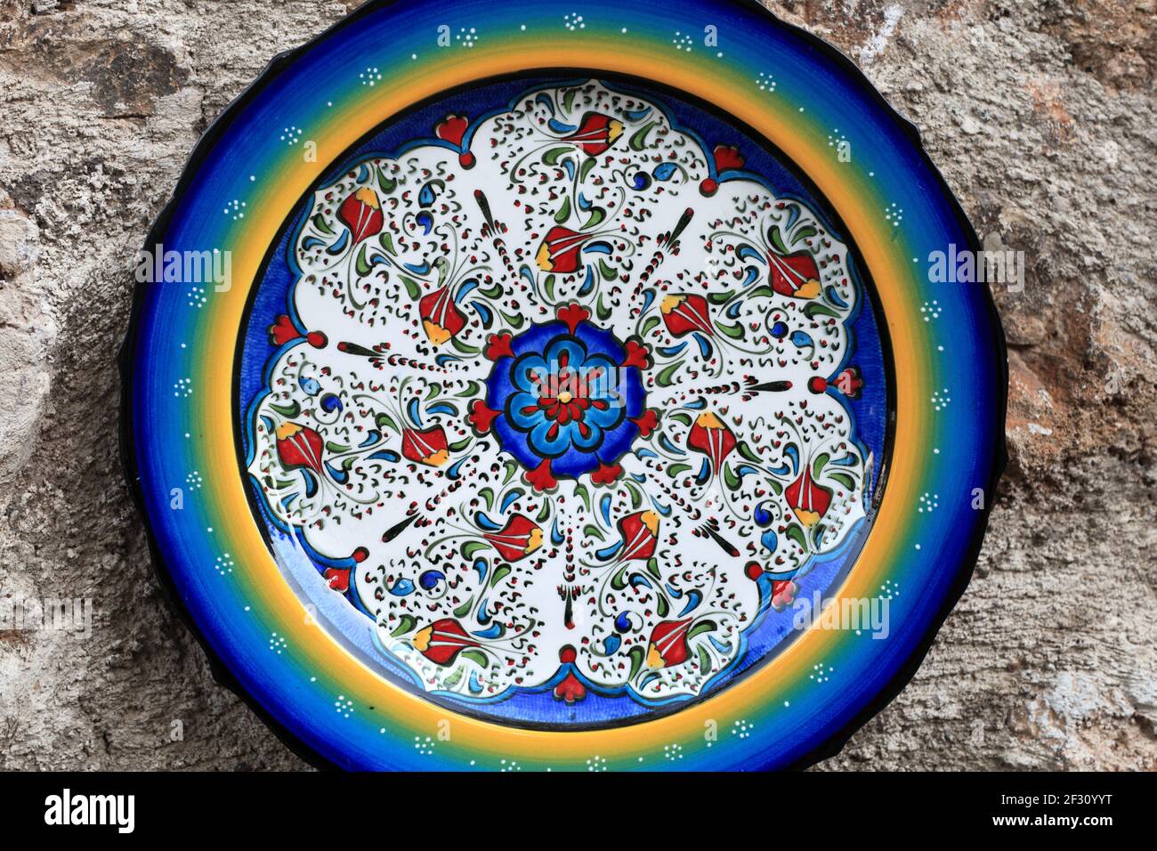 Details of a turkish plate on a wall background Stock Photo - Alamy